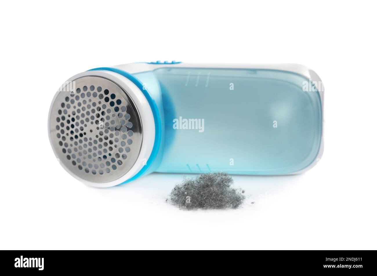Modern fabric shaver and lint on white background Stock Photo - Alamy