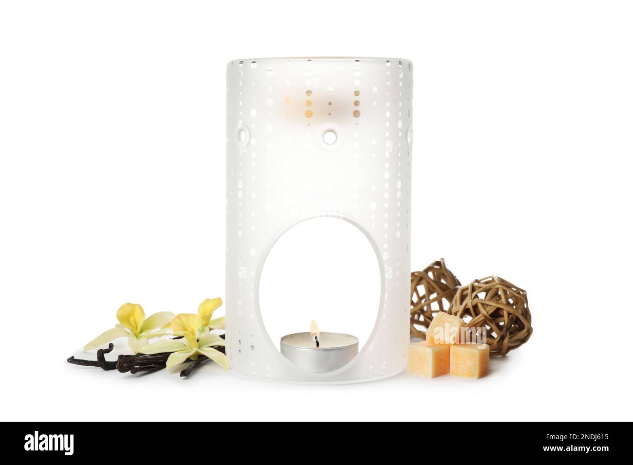 Stylish aroma lamp with essential wax cubes, flowers and vanilla on ...
