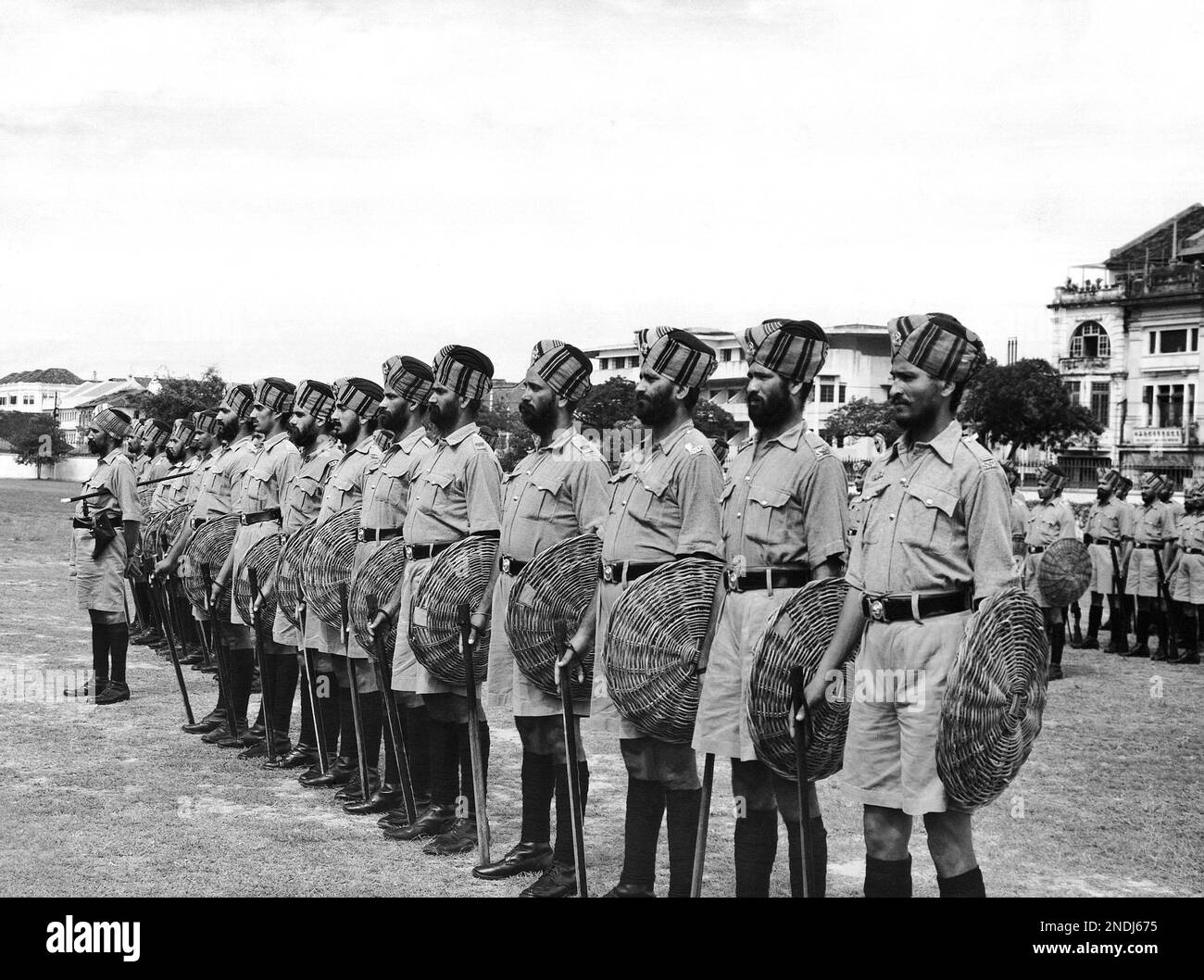 Members of the Sikh riot patrol lineup during an inspection of Straits ...