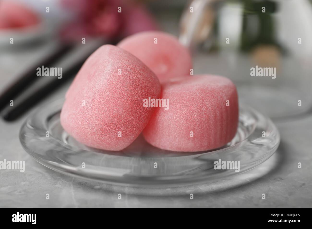 Glass plate with delicious mochi on grey table, closeup. Traditional ...