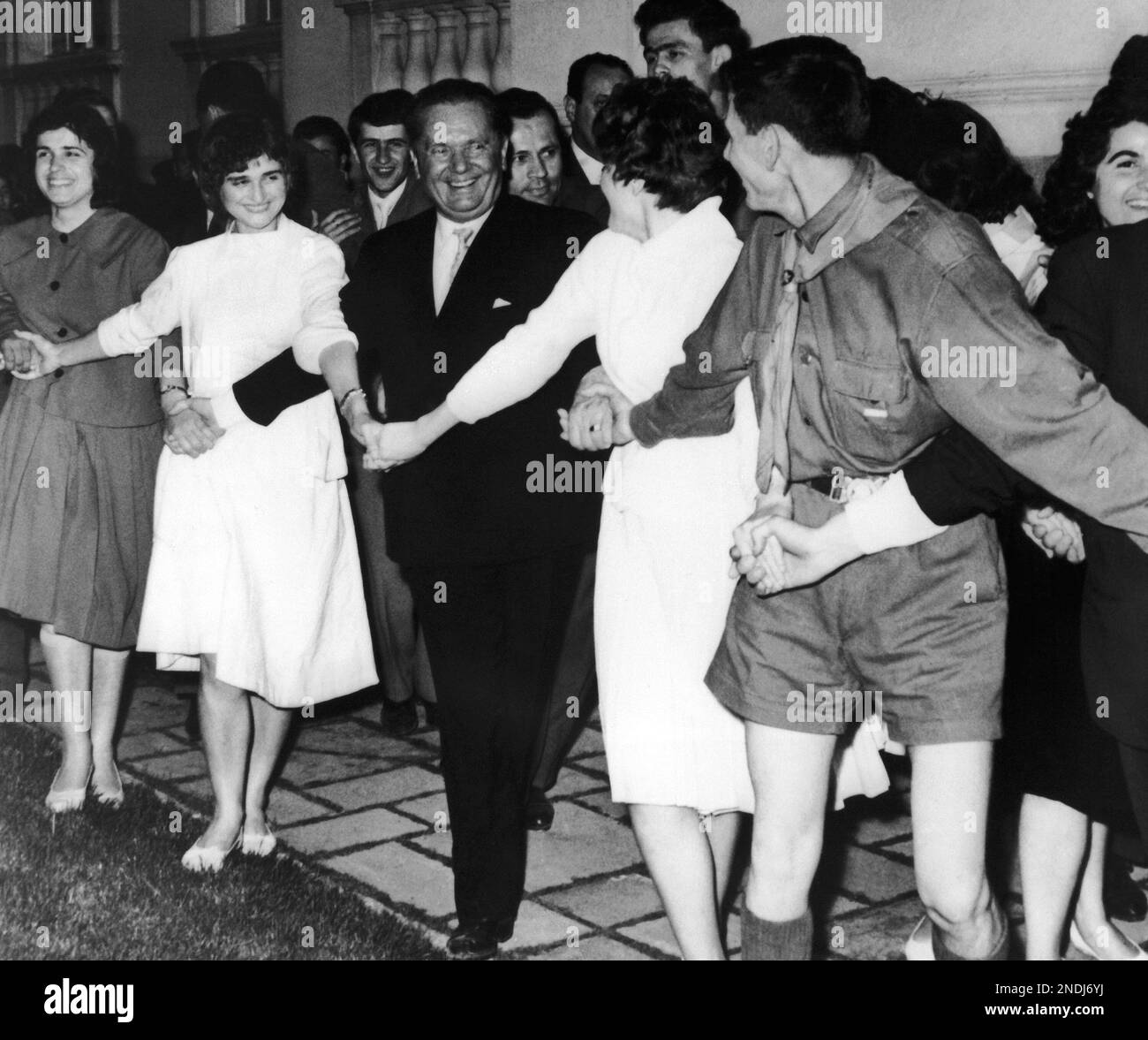 President Josip Broz Tito of Yugoslavia laughingly joins hands with ...