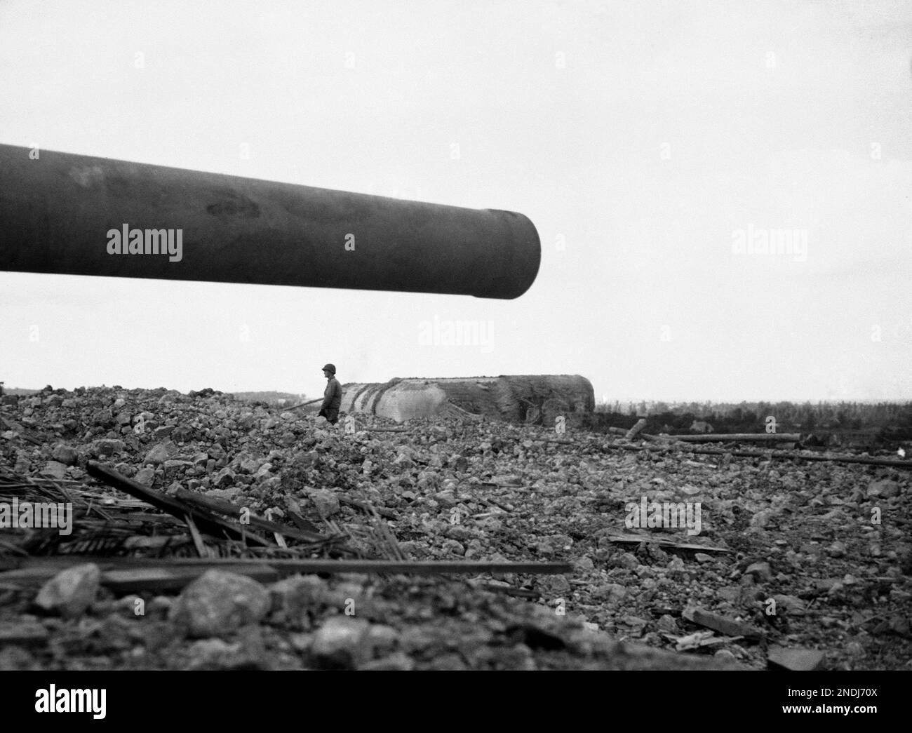 A German concrete strong point and the muzzle of a German coast ...