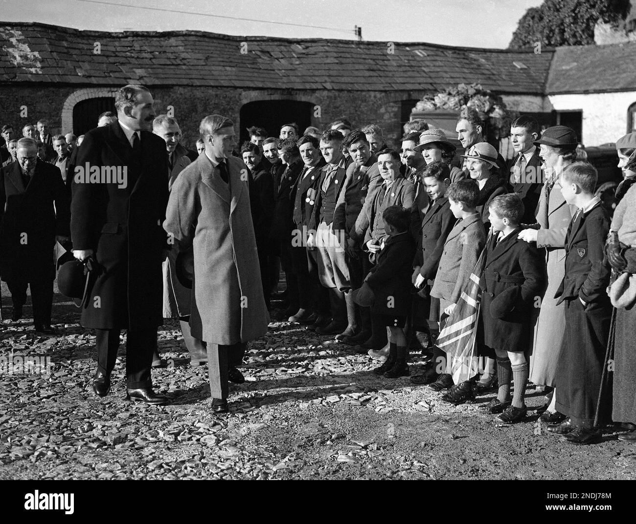 Britain's King Edward VIII inspects a line of Boverton Farm workers ...