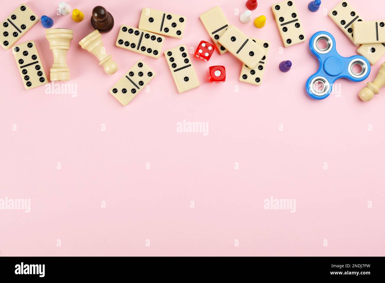 Components of board games on pink background, flat lay. Space for text ...