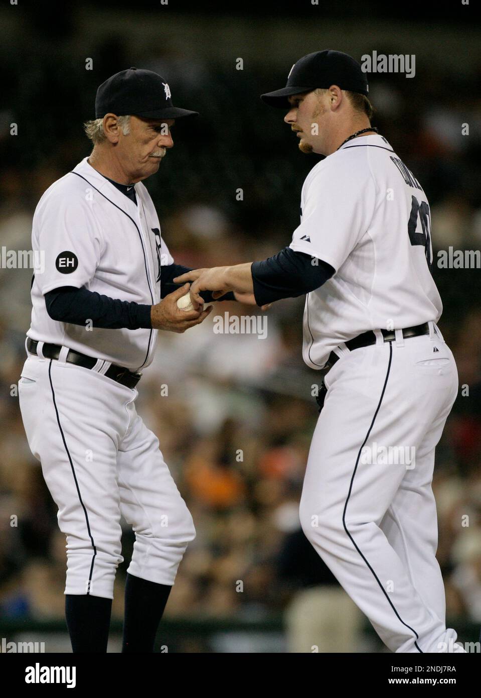 Detroit Tigers pitcher Phil Coke, right, is relieved by manager Jim ...