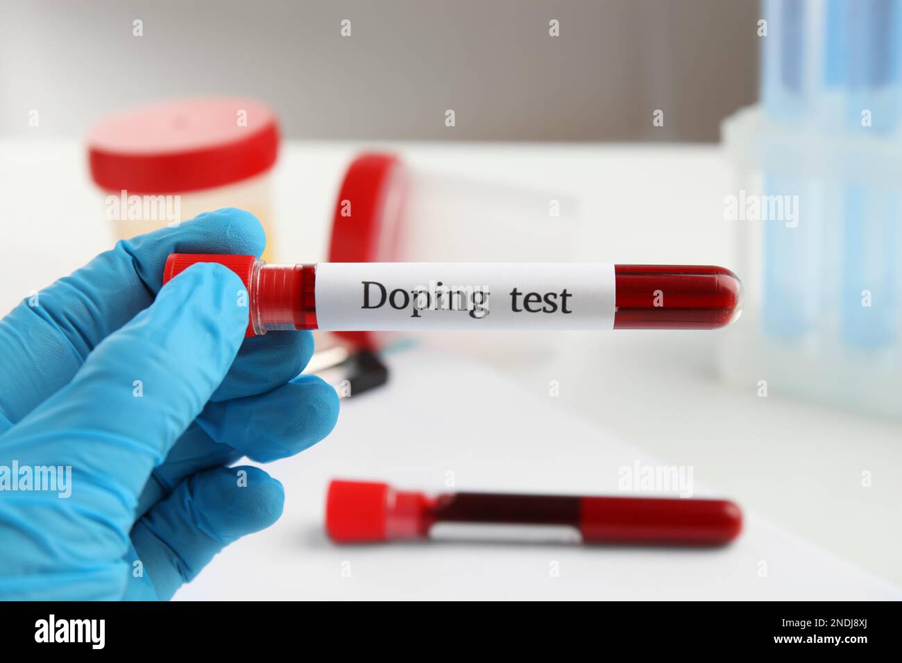 Doctor holding test tube with blood sample, closeup. Doping control ...