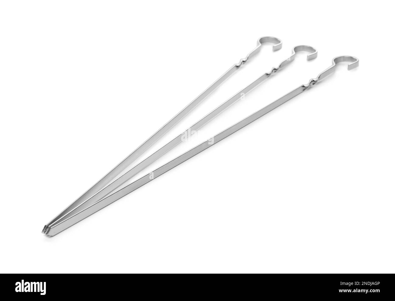 Metal skewers on white background. Barbecue utensil Stock Photo - Alamy