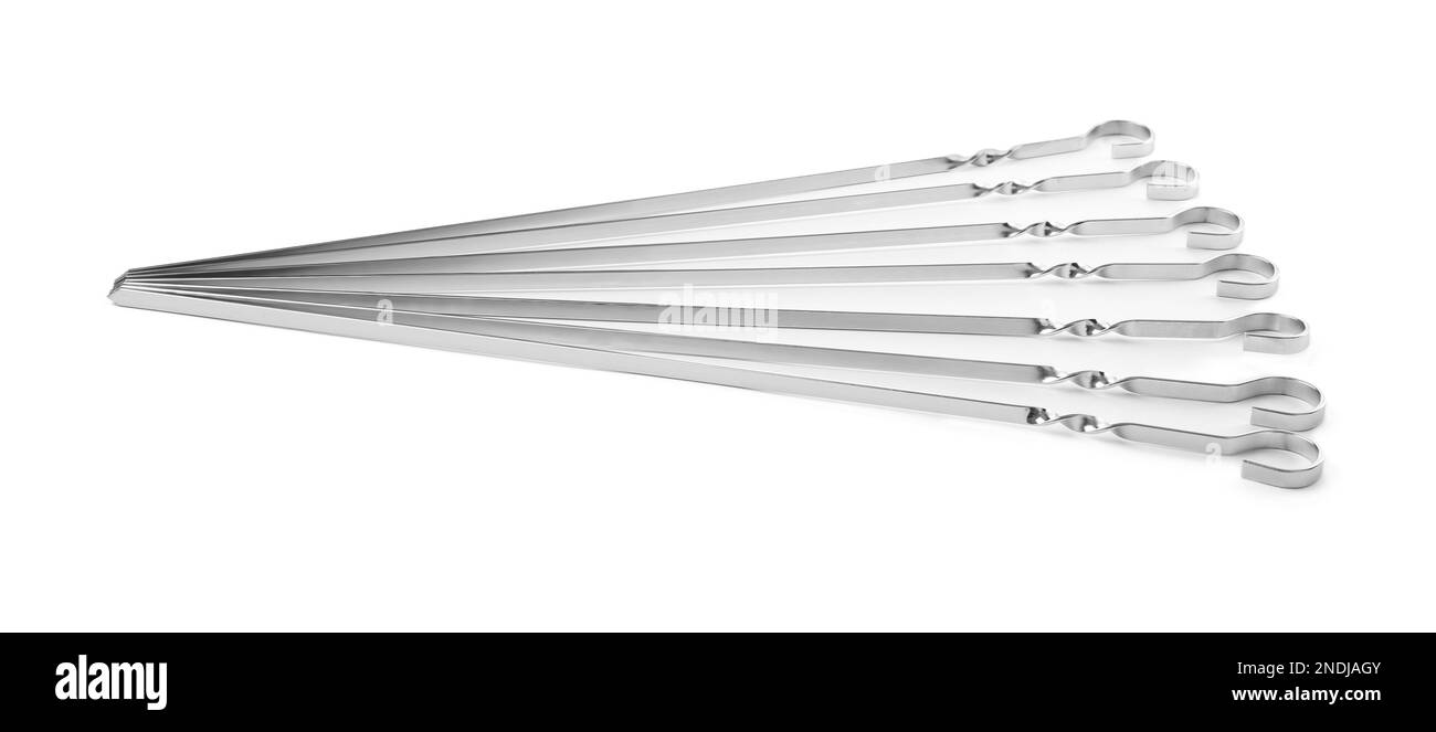 Metal skewers on white background. Barbecue utensil Stock Photo - Alamy