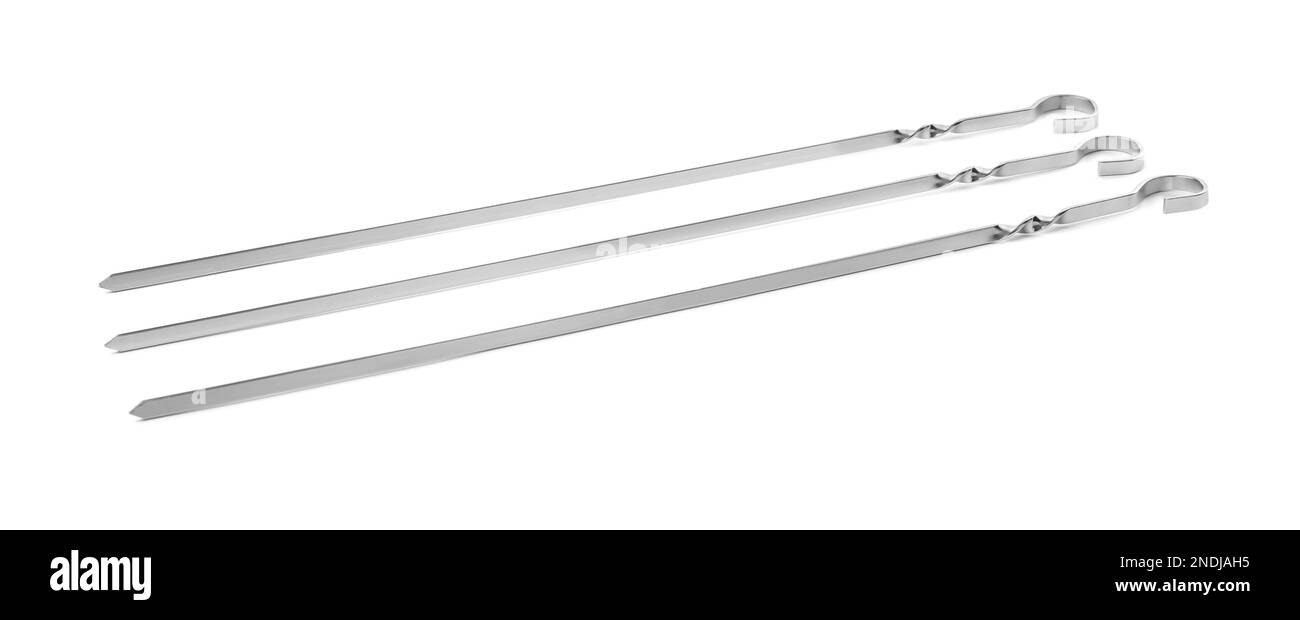 Metal skewers on white background. Barbecue utensil Stock Photo - Alamy