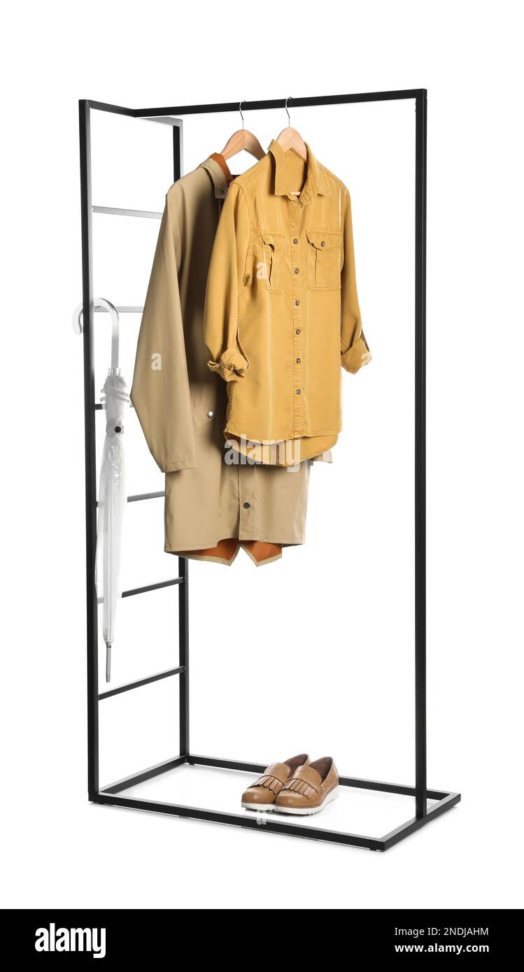 Stylish rack with clothes and shoes on white background Stock Photo - Alamy