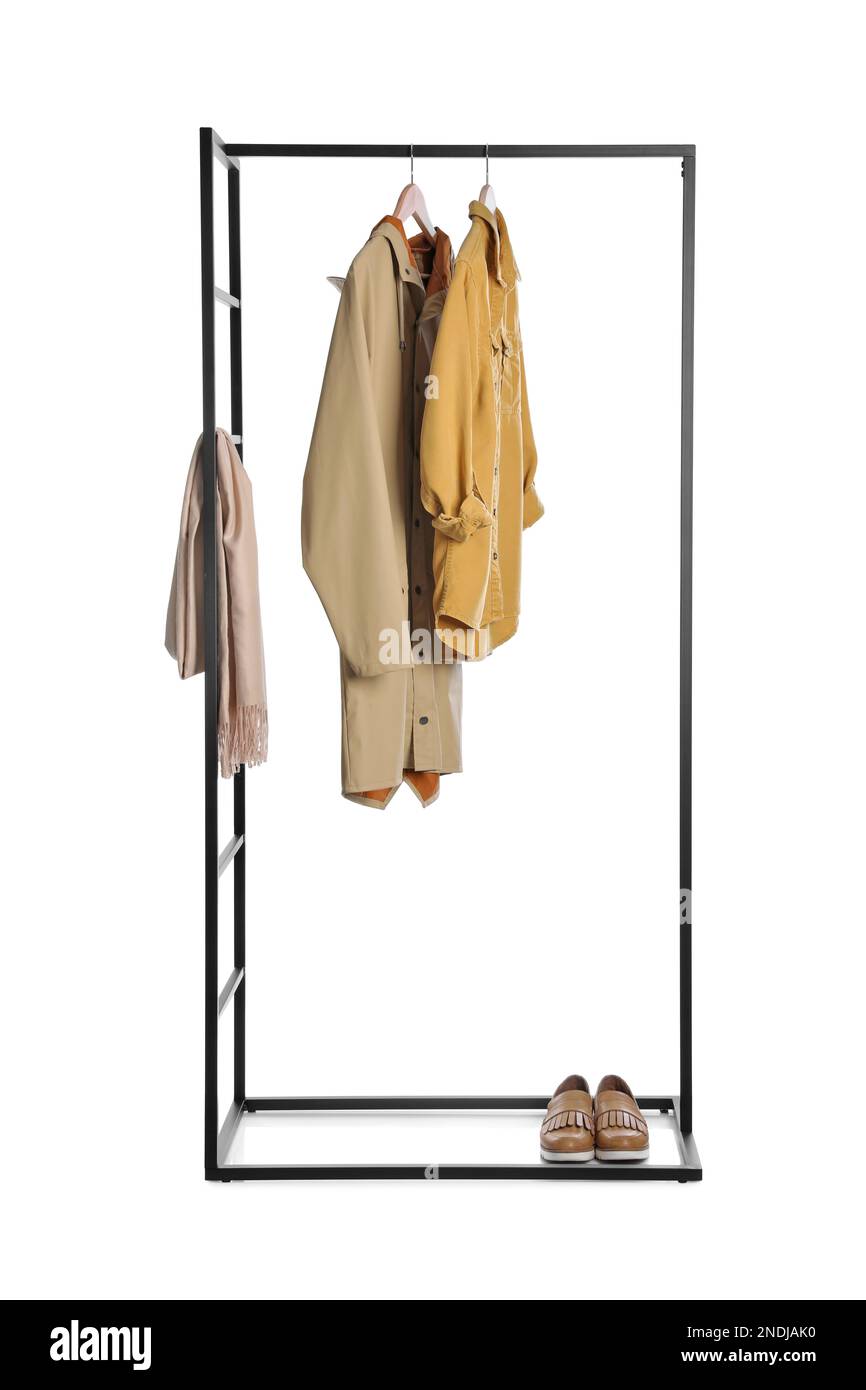 Stylish rack with clothes and shoes on white background Stock Photo - Alamy