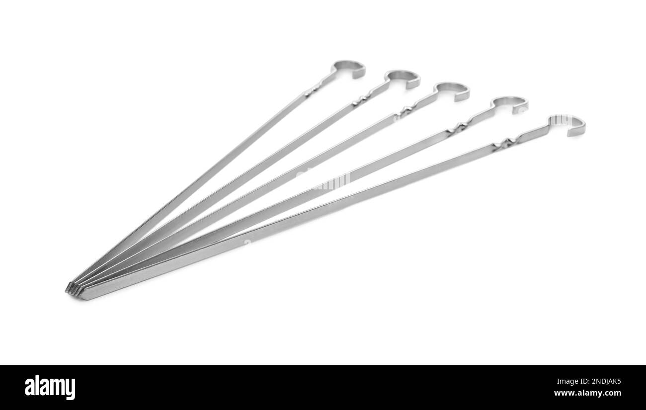 Metal skewers on white background. Barbecue utensil Stock Photo - Alamy