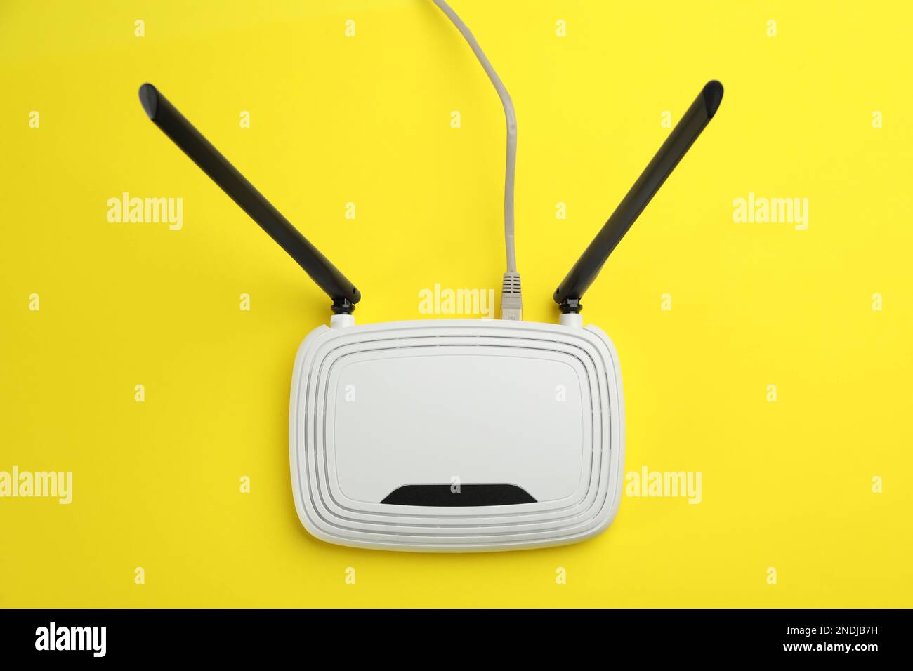 Modern Wi-Fi router on yellow background, top view Stock Photo - Alamy