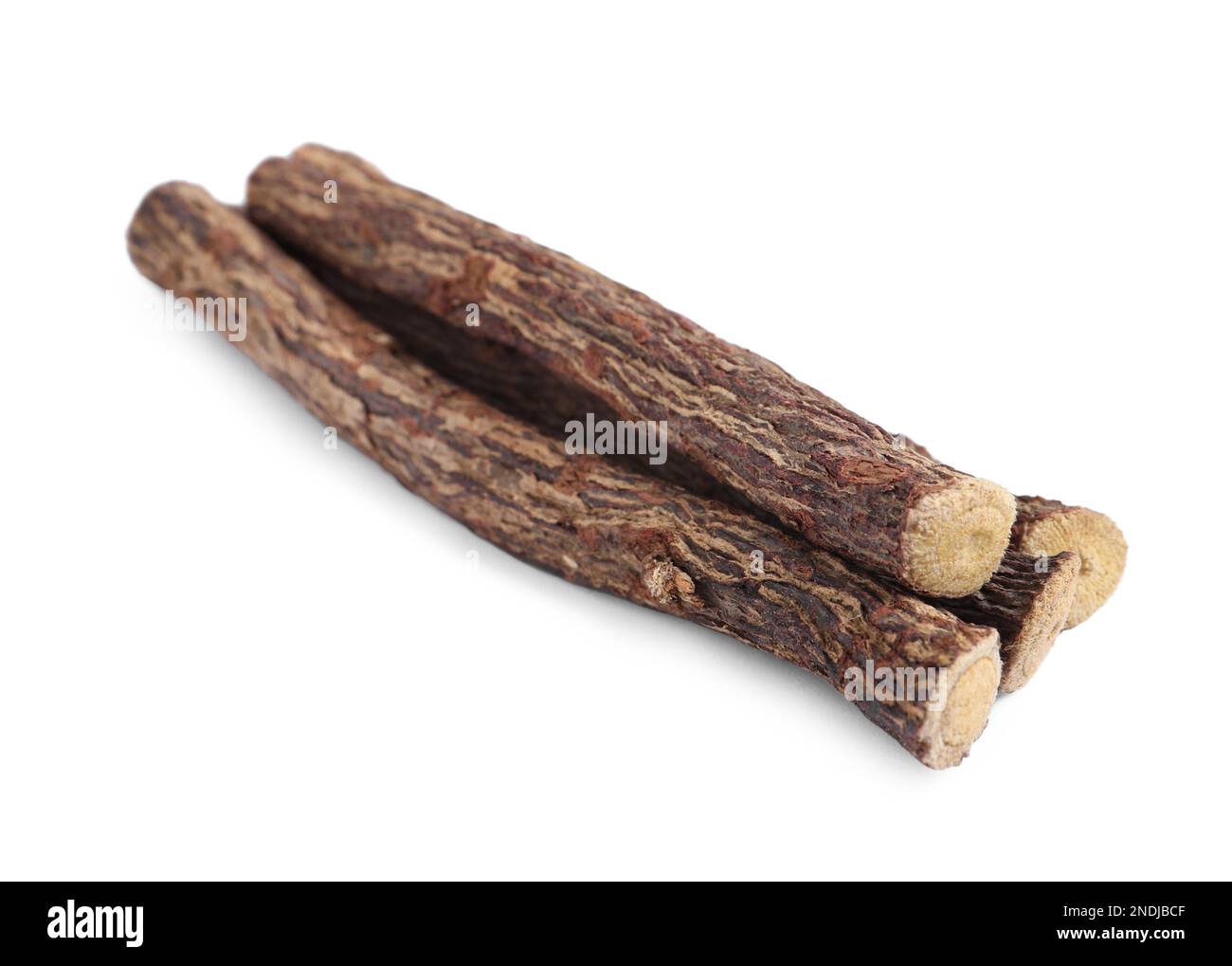 Dried sticks of liquorice root on white background Stock Photo - Alamy