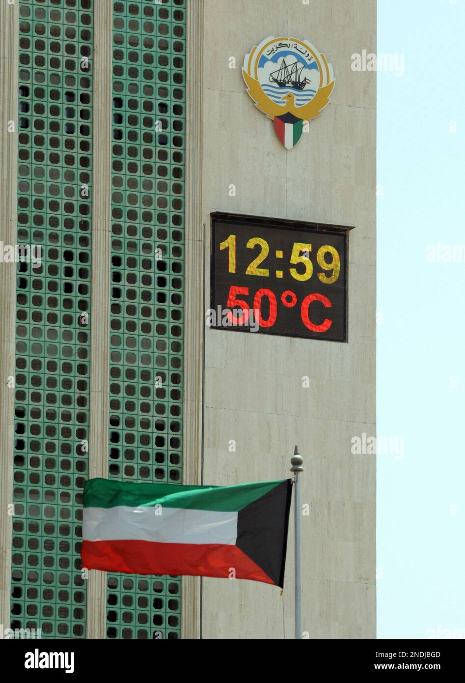View of the Ministry of Electricity and Water clock tower in Zahra area ...