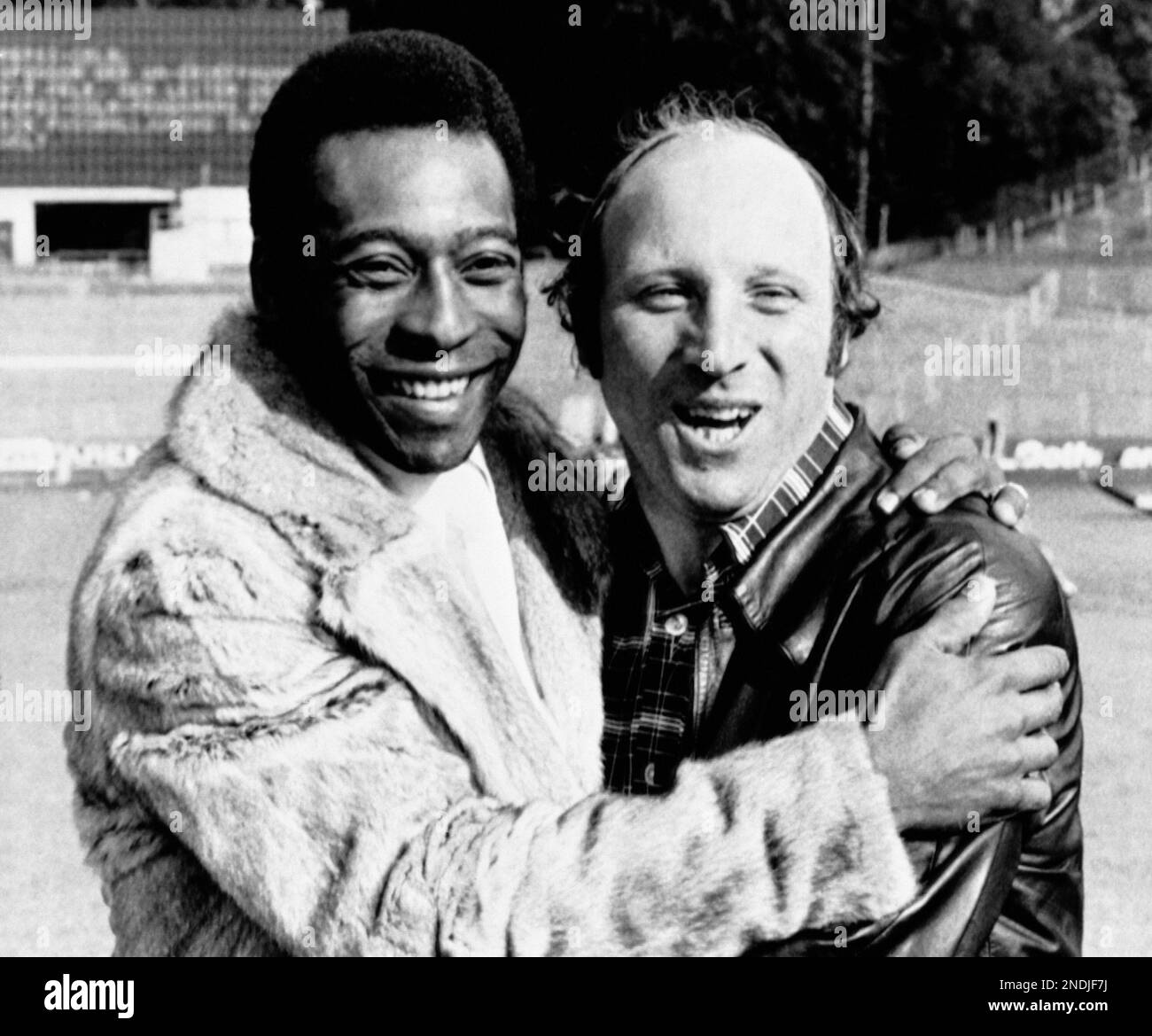 Brazilian soccer star Pele, left, embraces famous West German center ...