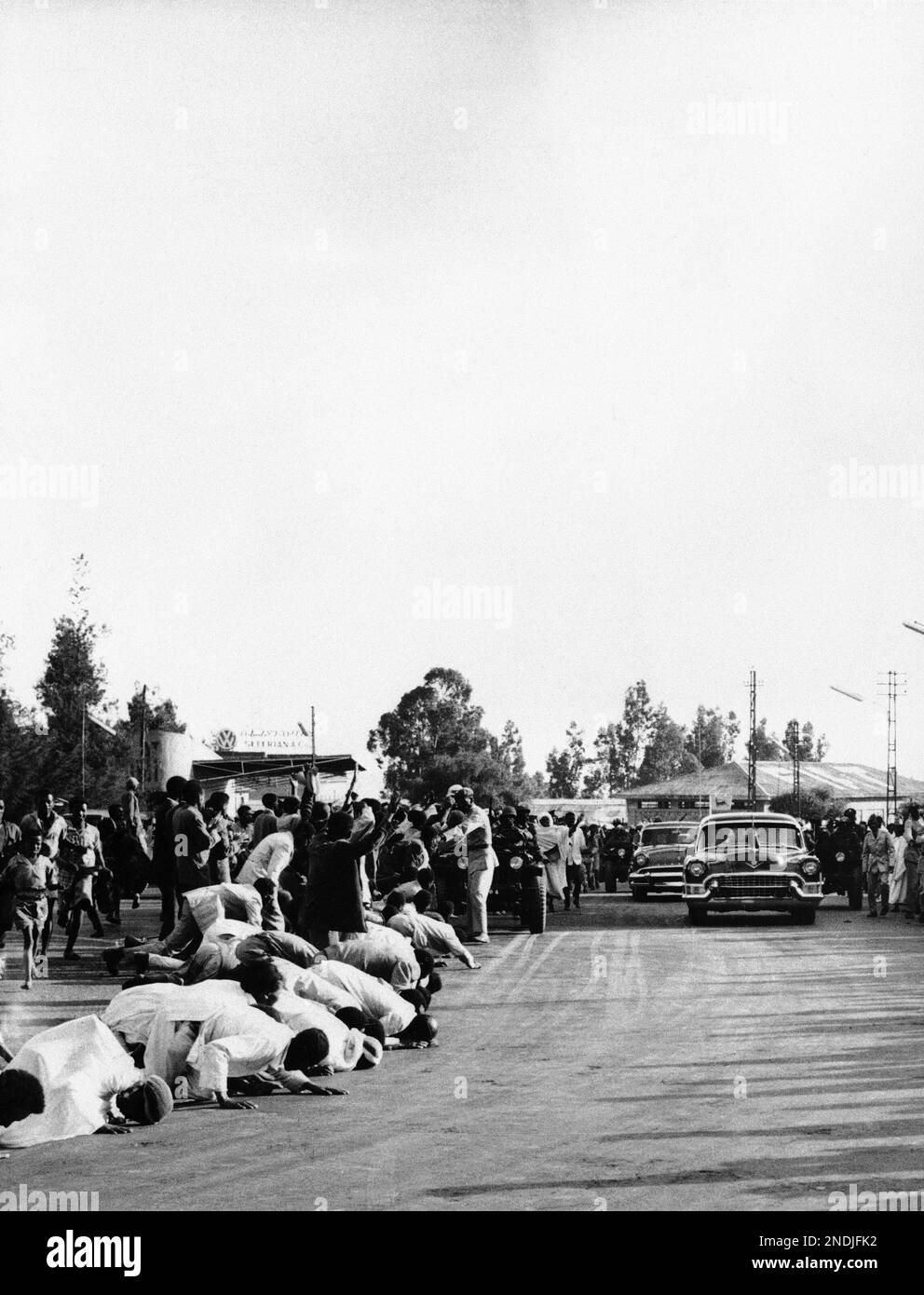 Loyal Ethiopians, who feel safe again, kneel and kiss the ground as ...