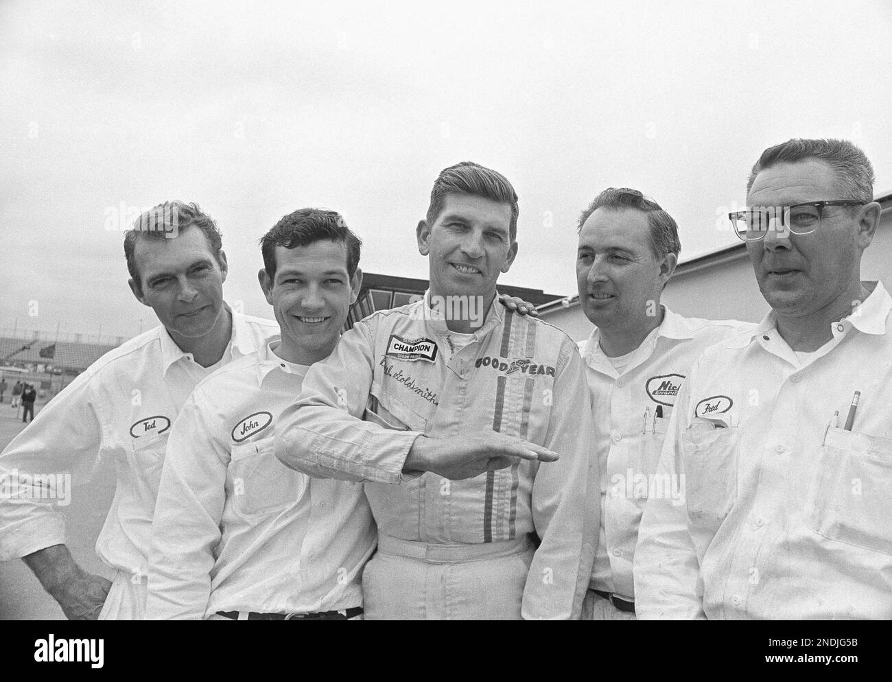 Paul Goldsmith, center, of Munster, Ind., tells two of his mechanics ...