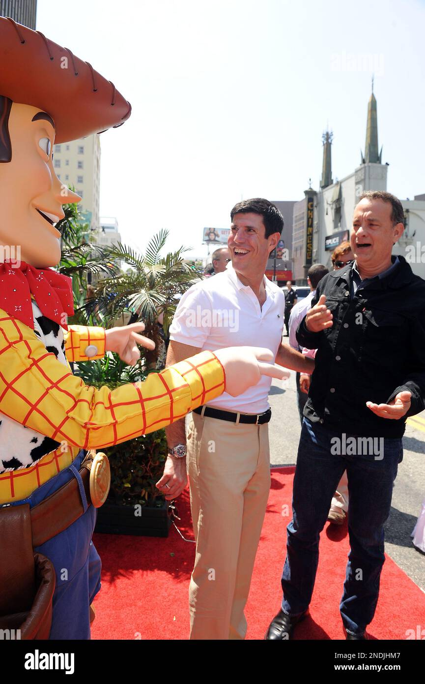 Rich Ross, at left, and Tom Hanks arrives at the world premiere of Toy ...