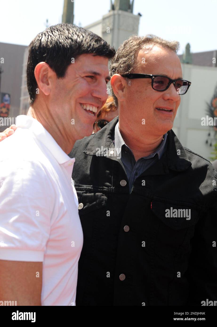Rich Ross, at left, and Tom Hanks arrives at the world premiere of Toy ...