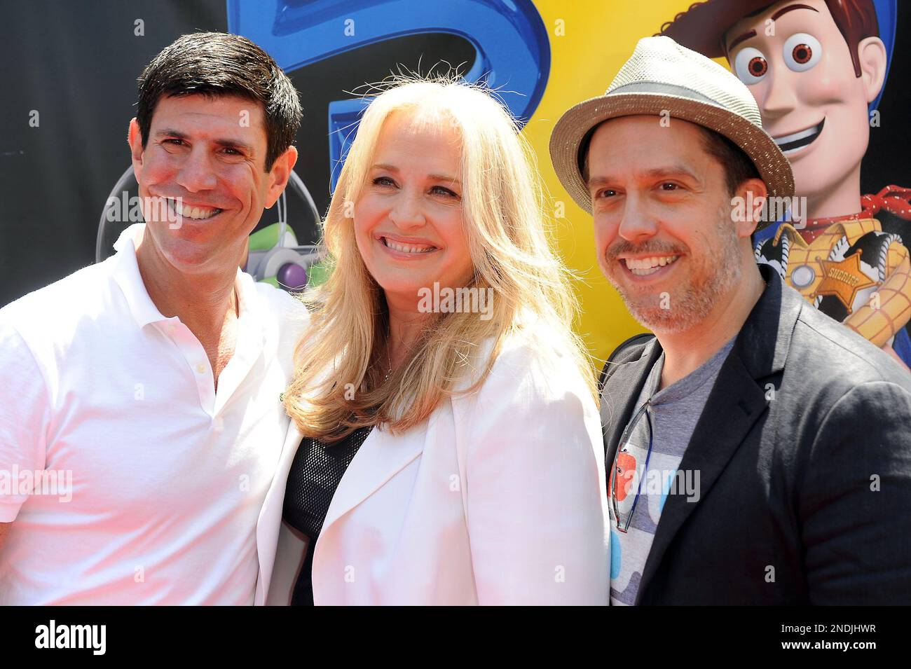 From left, Rich Ross, Darla K. Anderson, and Lee Unkrich arrive at the ...