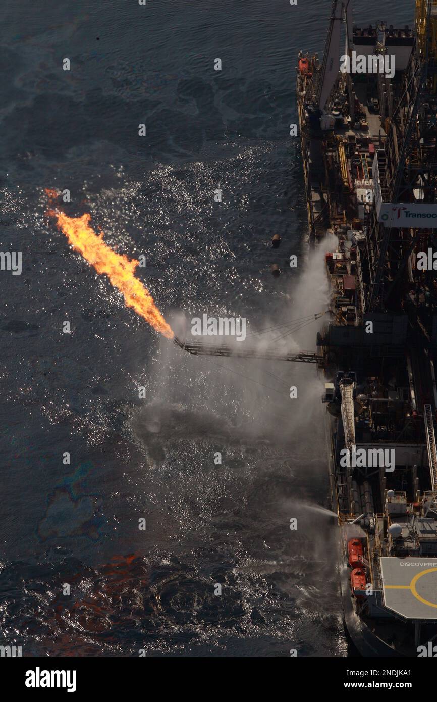 The Transocean Deepwater Discoverer drilling rig operates over the site ...