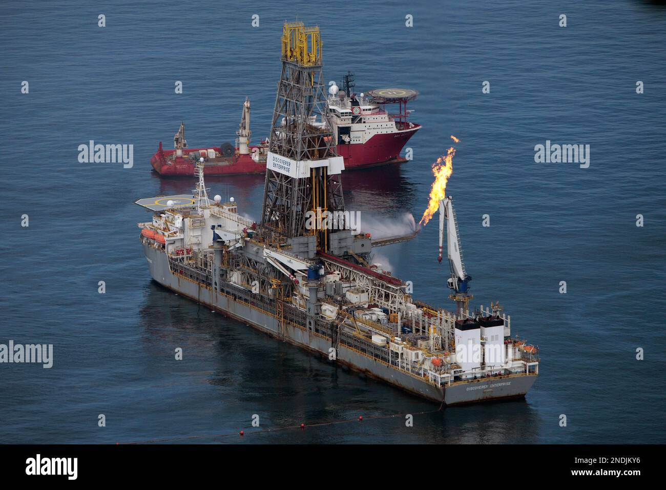 The Transocean Deepwater Discoverer drilling rig operates over the site ...
