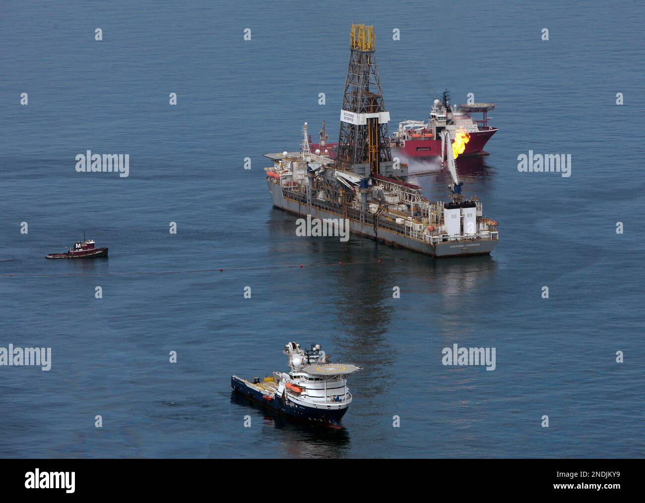 The Transocean Deepwater Discoverer drilling rig operates over the site ...