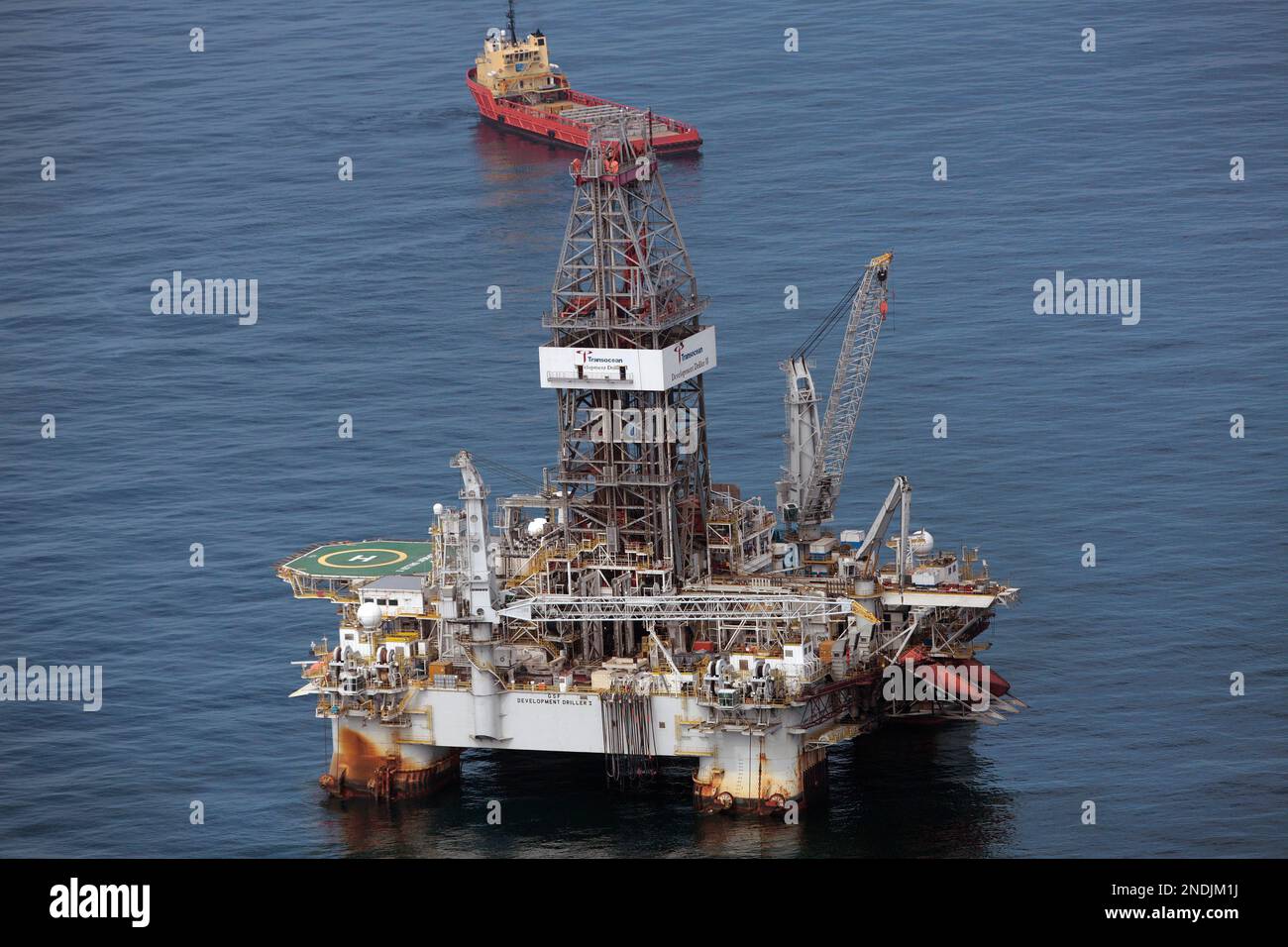 Vessels operate near a drilling rig at the site of the Deepwater ...
