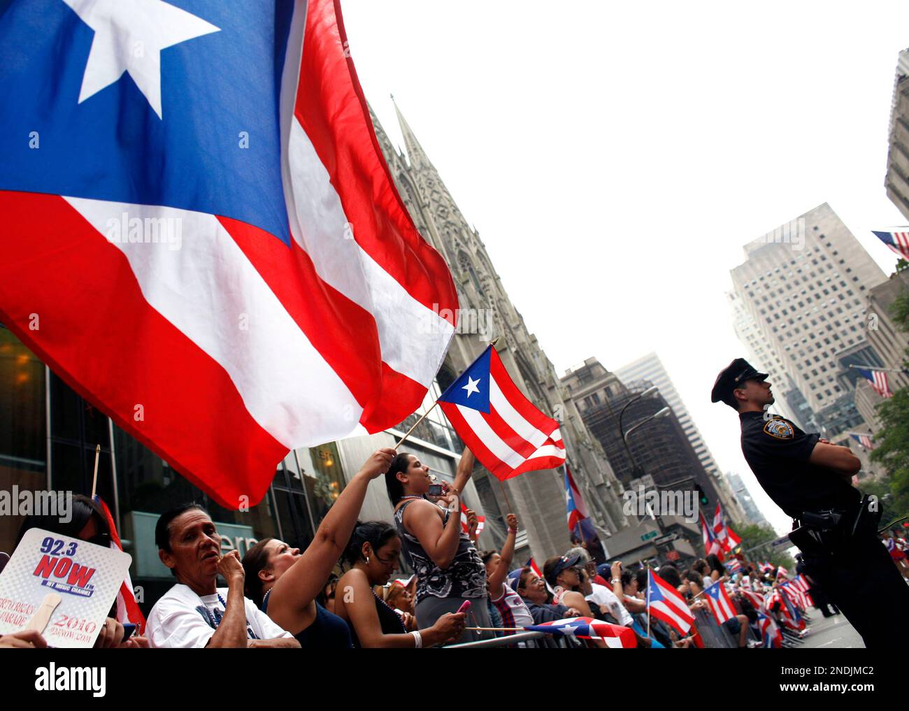 Puerto Rican flags wave as spectators line Fifth Avenue during the ...