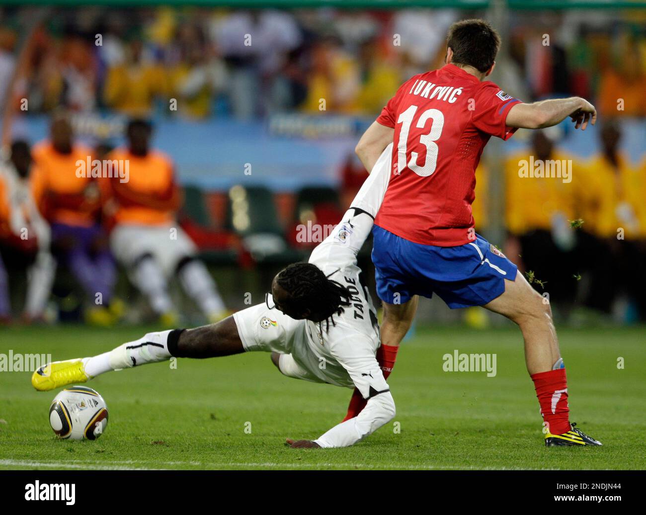 Ghana's Prince Tagoe, left, and Serbia's Aleksandar Lukovic compete ...