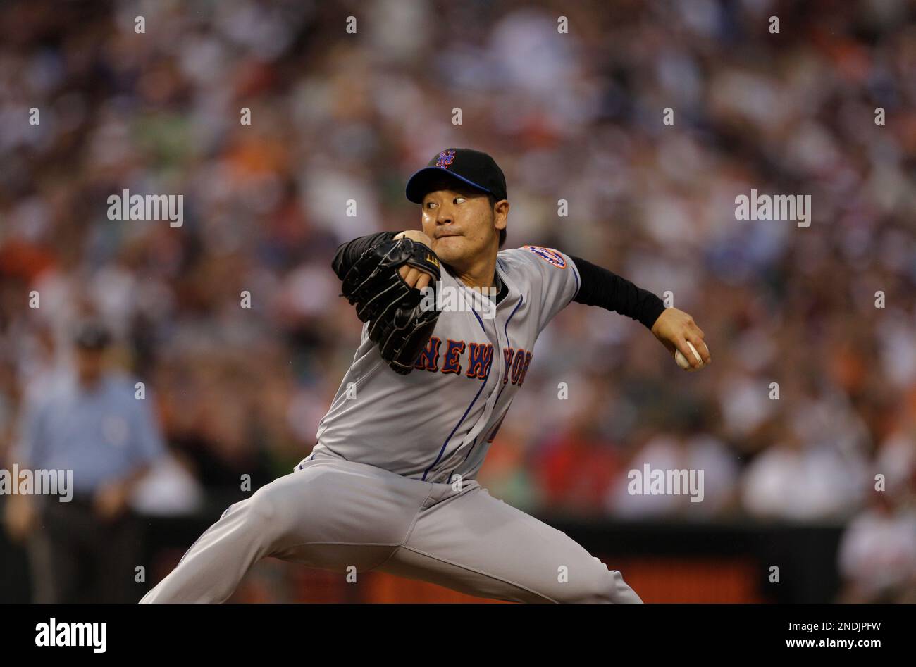 New York Mets starting pitcher Hisanori Takahashi of Japan, delivers to ...