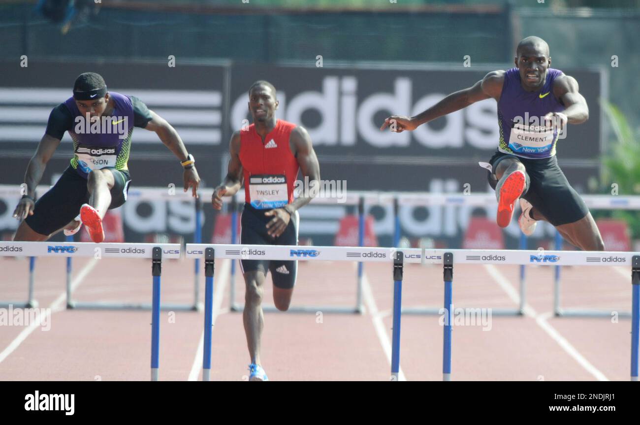Kerron Clement of the U.S., right, clears the final hurdle en route to ...