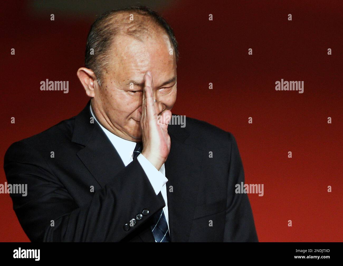 Hong Kong film director John Woo gestures as he arrives at the opening ...