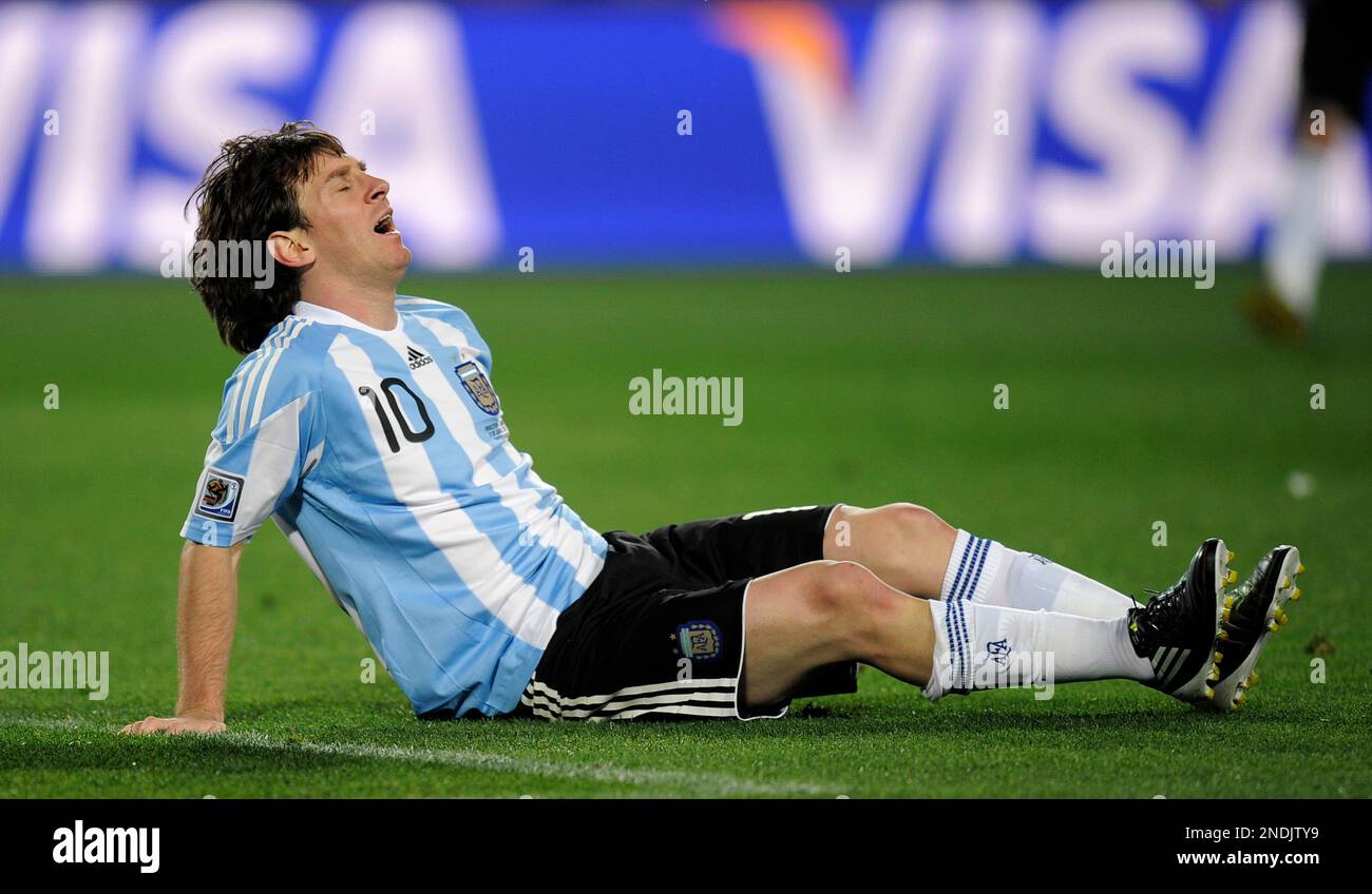 Argentina's Lionel Messi reacts after taking a fall during the World ...
