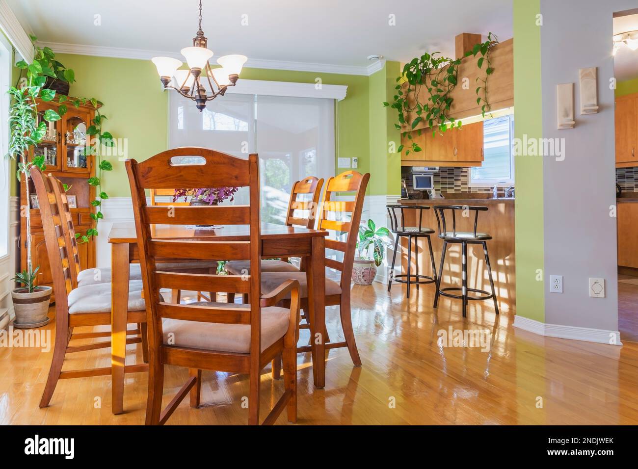 Ash wood table and chairs in dining room with oak wood floorboards ...