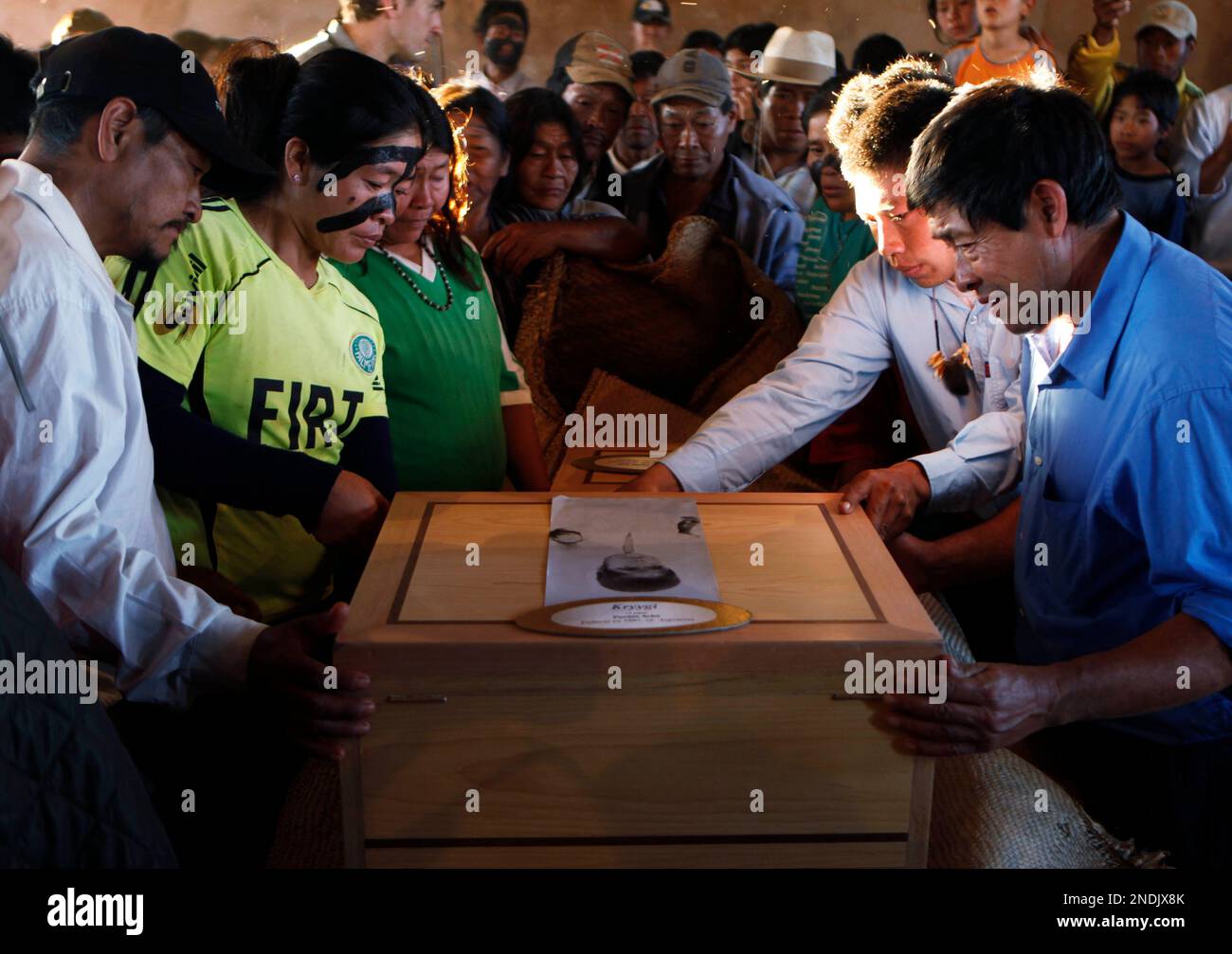 Ache Indigenous people open a coffin containing the bones an Ache woman ...