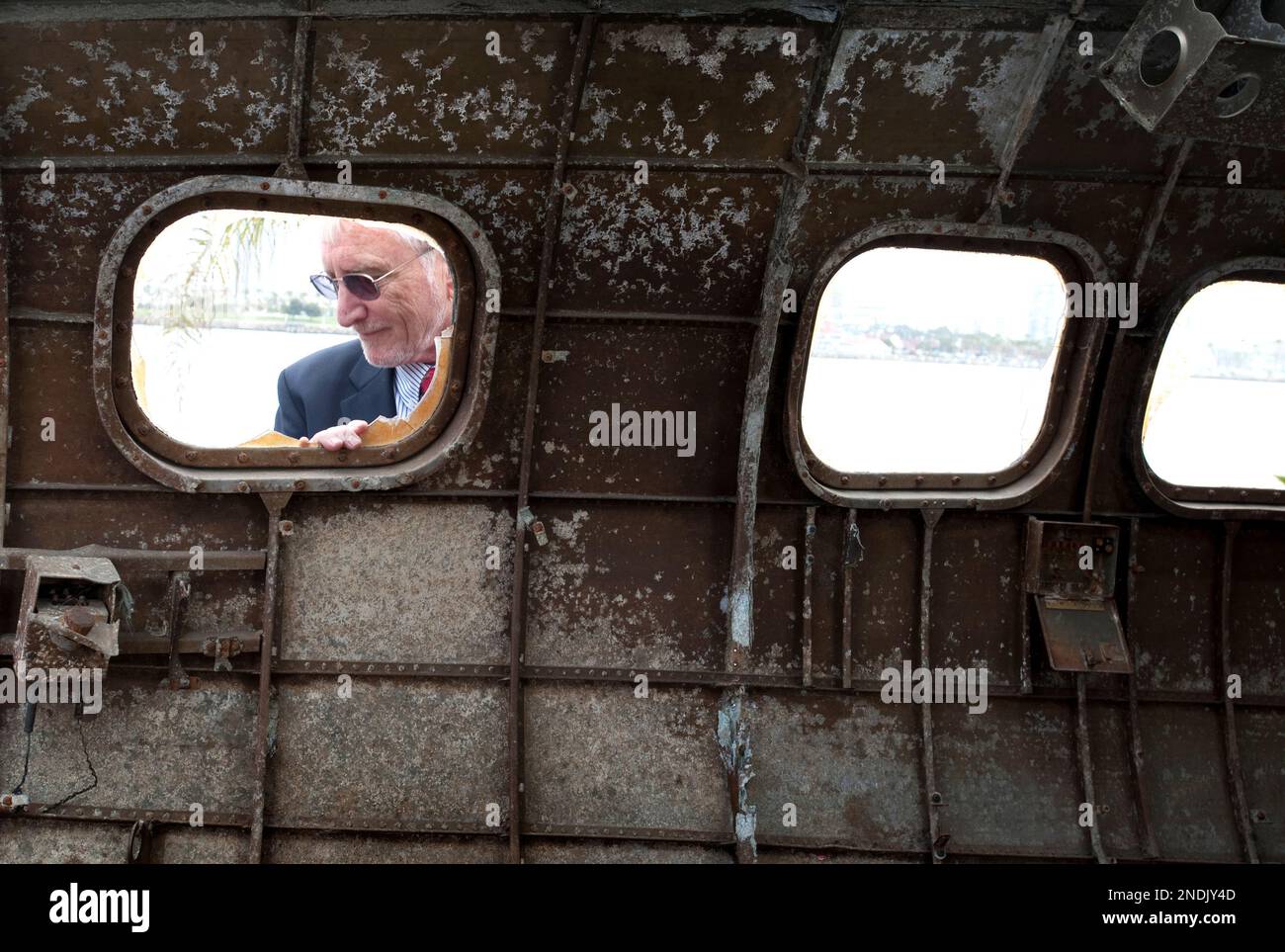 Mike Oliver examines the Swamp Ghost, a B-17E bomber which crashed in a ...