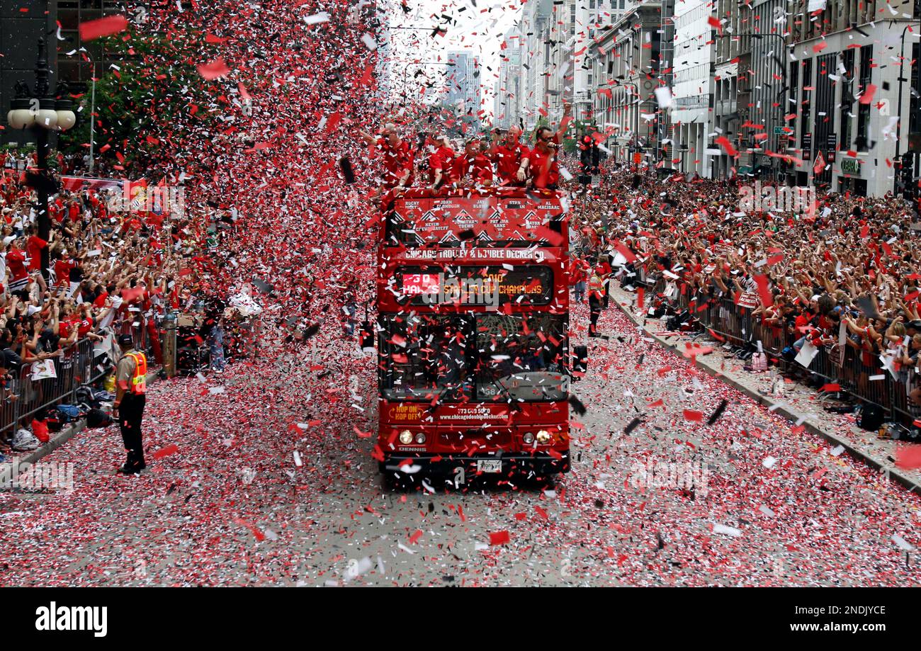 Chicago Blackhawks players and staff members celebrate in a bus during ...