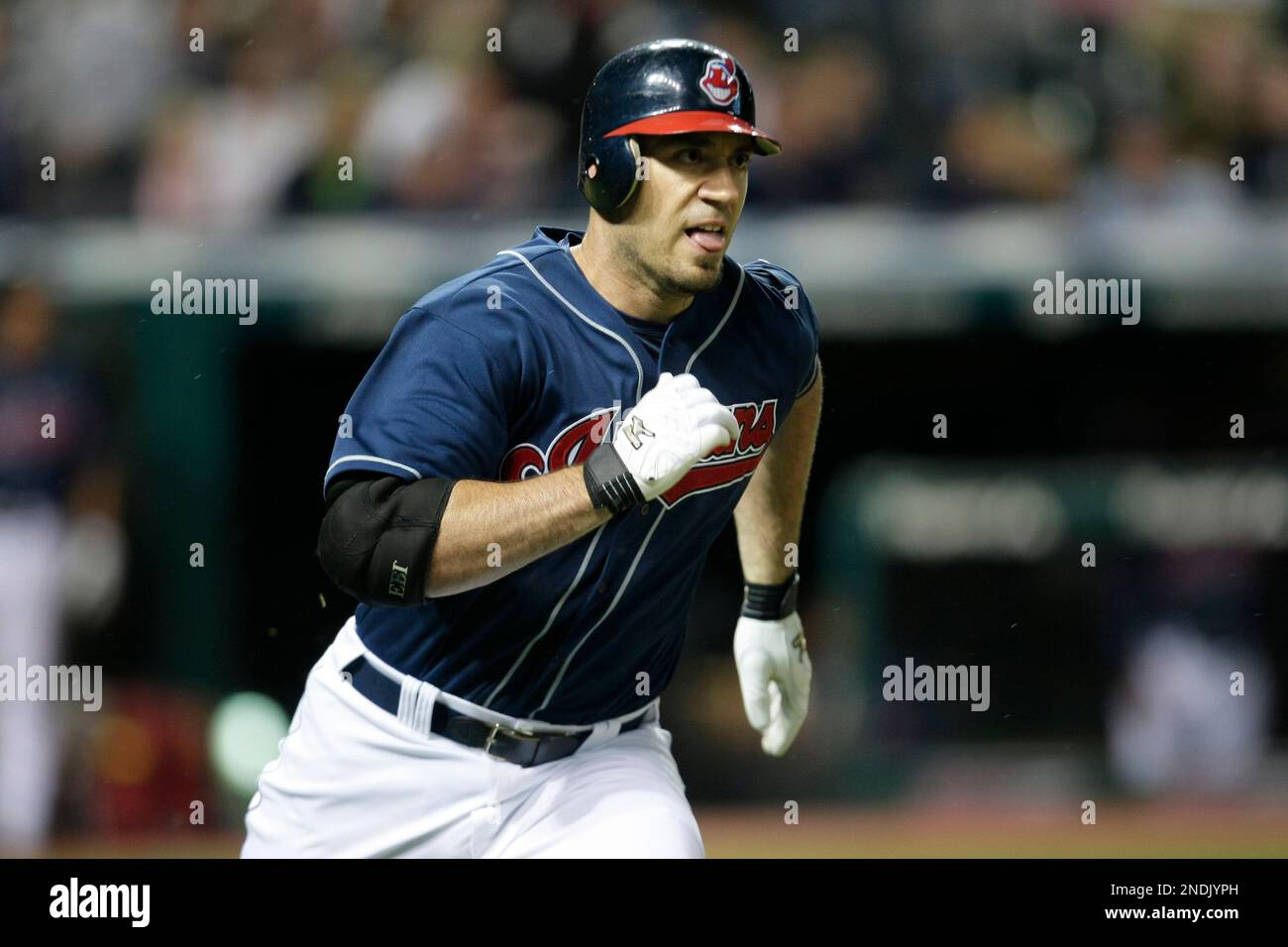 Cleveland Indians' Travis Hafner runs to first base after hitting ...