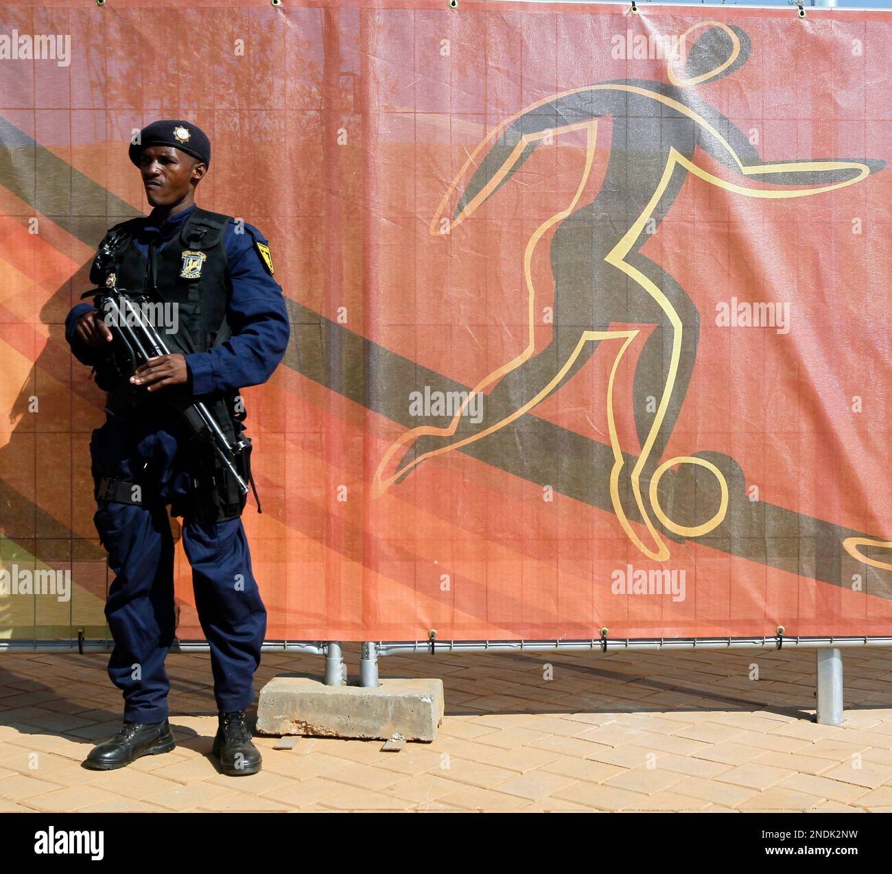 A security guard stands outside of Soccer City Stadium before the World ...