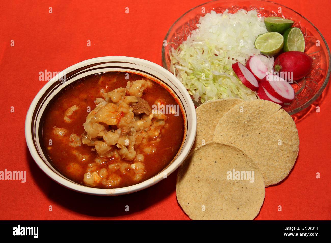 Typical Mexican food, plate of pozole with corn, meat, vegetables and ...