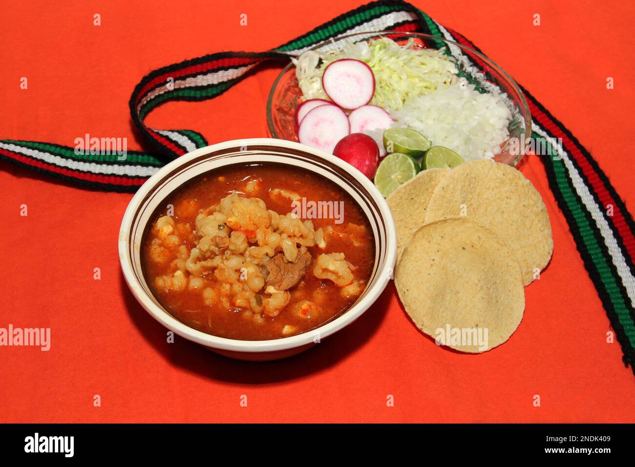 Typical Mexican food, plate of pozole with corn, meat, vegetables and ...