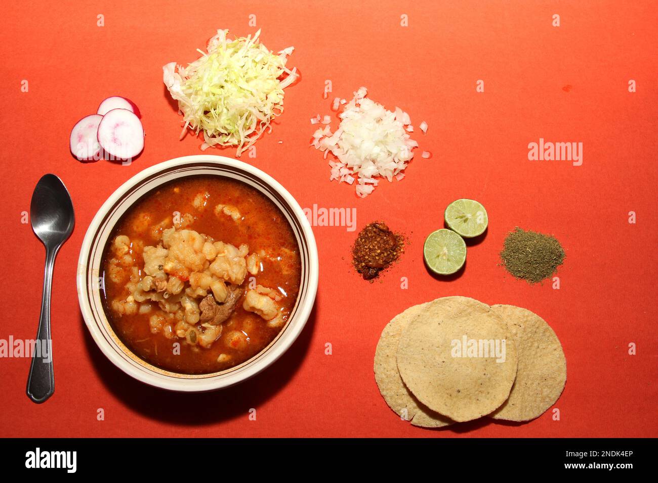 Typical Mexican food, plate of pozole with corn, meat, vegetables and ...
