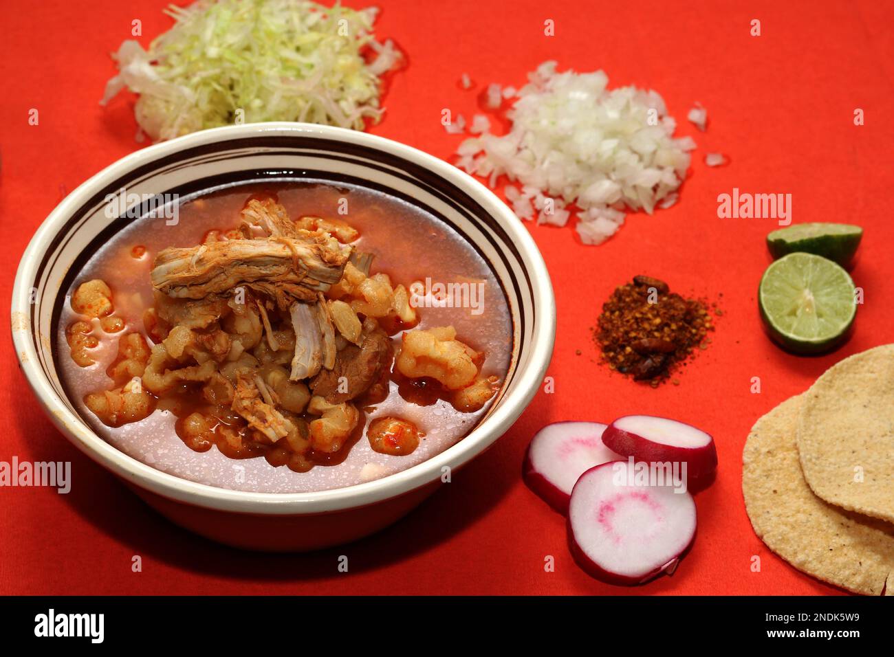 Typical Mexican food, plate of pozole with corn, meat, vegetables and ...