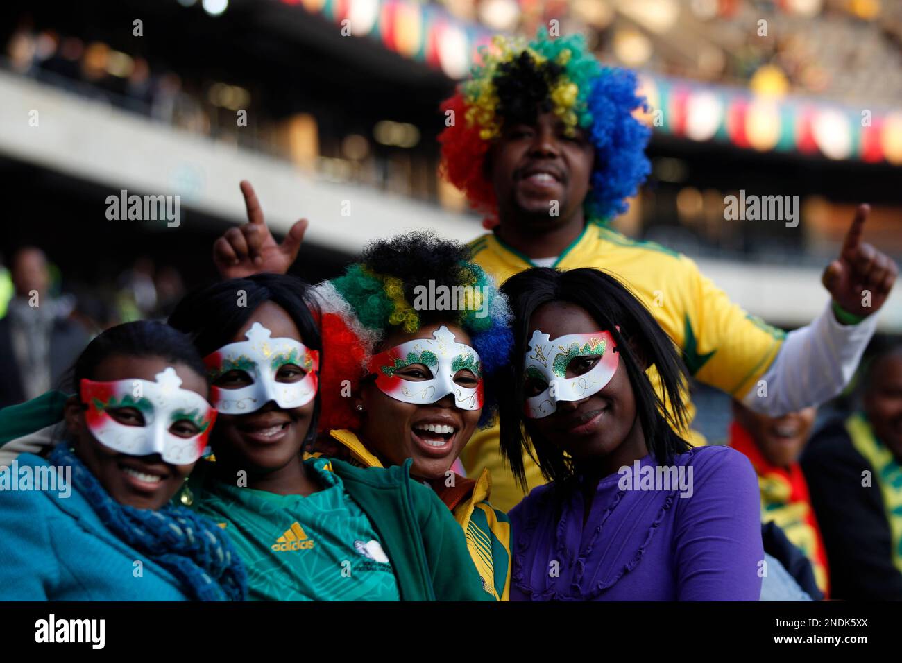 South African soccer fans pose for picture during the opening concert ...