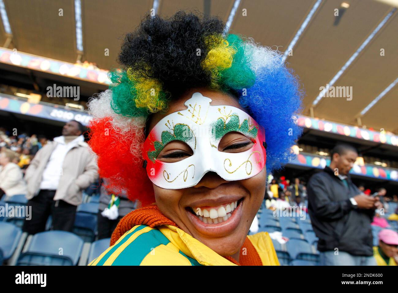 A South African soccer fan poses for picture during the opening concert ...