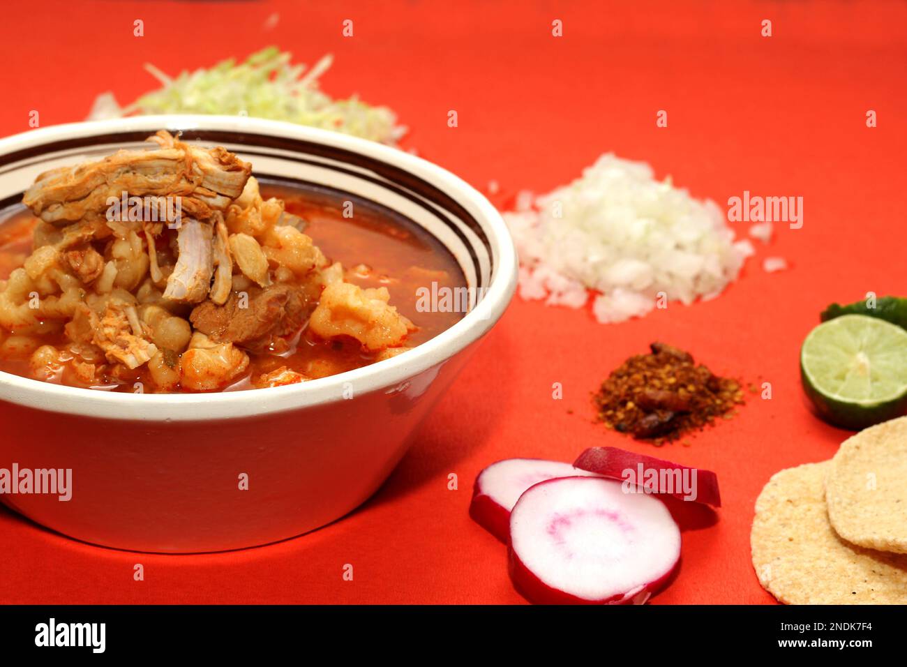 Typical Mexican food, plate of pozole with corn, meat, vegetables and ...