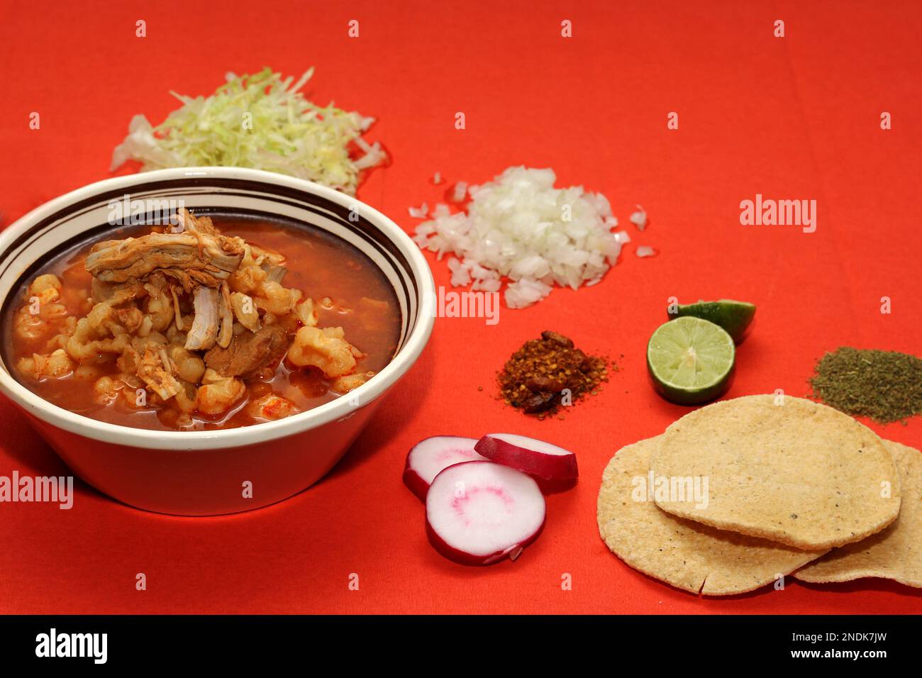 Typical Mexican food, plate of pozole with corn, meat, vegetables and ...
