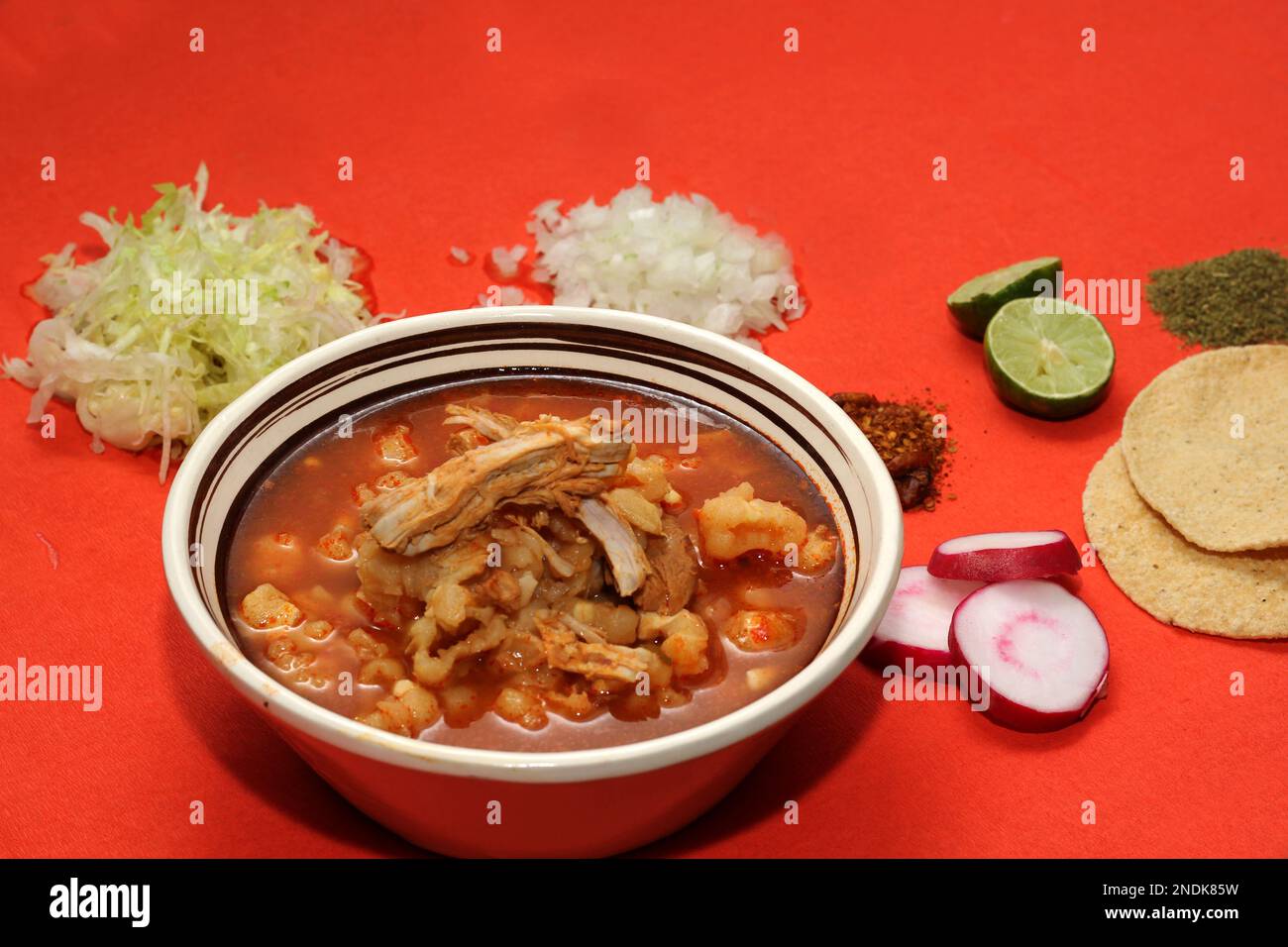 Typical Mexican food, plate of pozole with corn, meat, vegetables and ...